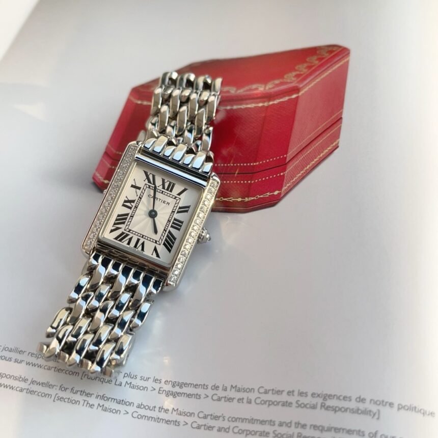 Cartier Tank Louis S. The S-shaped gold watch bracelet exudes a smooth ...